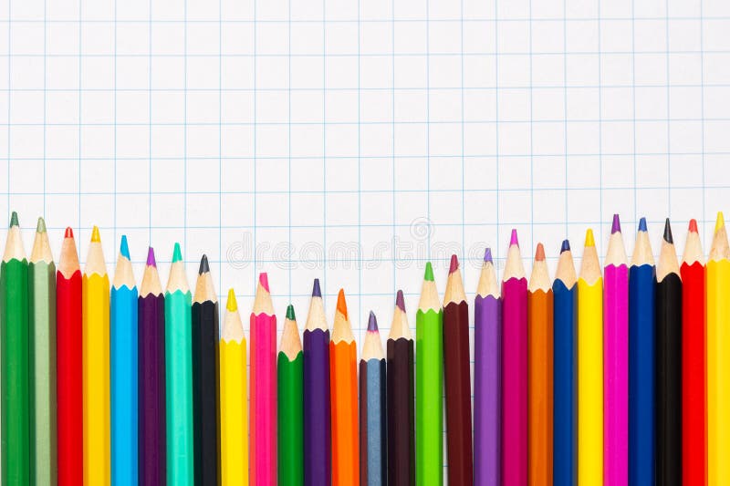 Multi-colored Pencils are on a White Checkered Sheet. Drawing Lesson ...