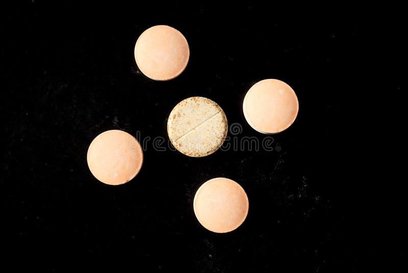 Multi-colored Pills on a Black Table. Multi-colored Round Pills Stock ...