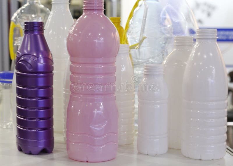 Multi-colored Plastic Bottles for Dairy Products. Bottles of Different ...