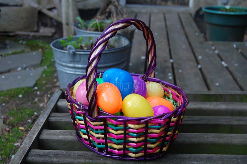 Multi-colored Plastic Easter Eggs in a Basket Stock Image - Image of ...