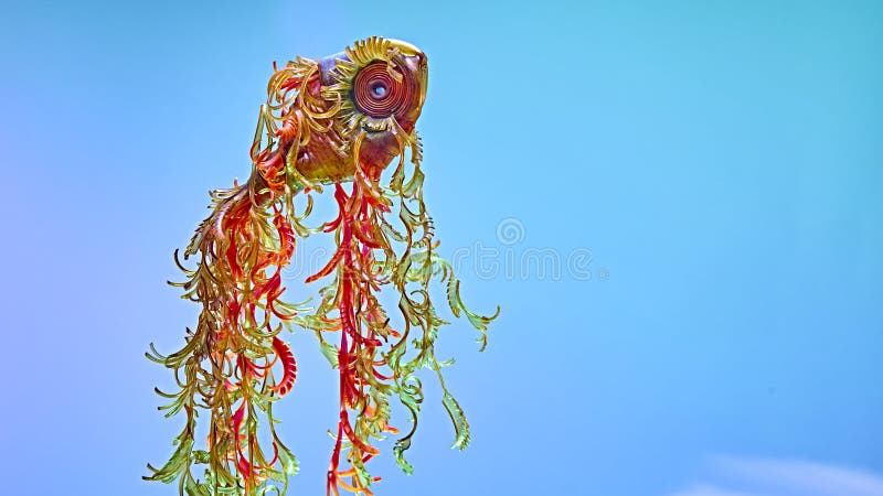 Multi-colored Plastic Fish Figurines in Blue Backround. Isolate. Color ...