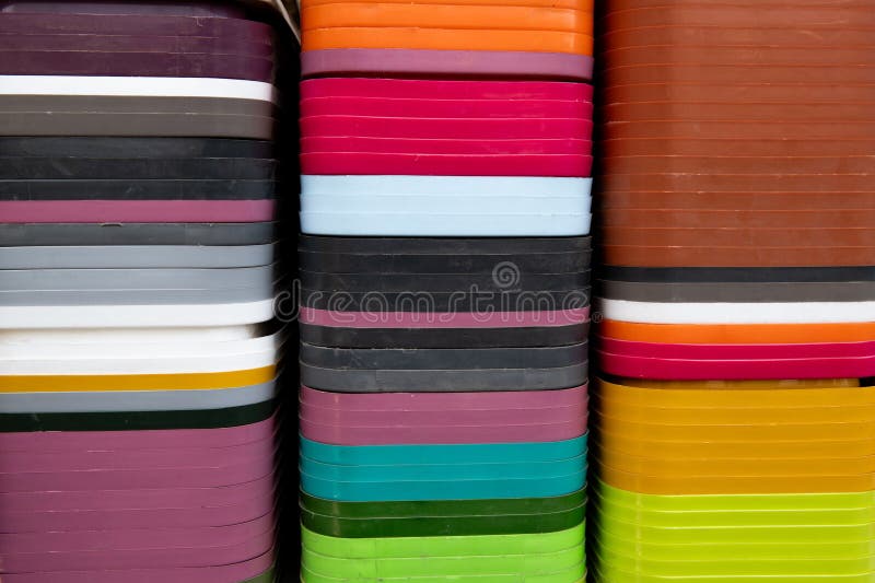 Multi-colored Plastic Plant Pots Stacked Tightly To Form an Abstract ...