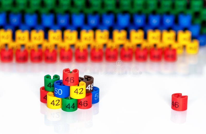 Multi-colored Plastic Size Labels for Hangers of Clothing Store on a ...