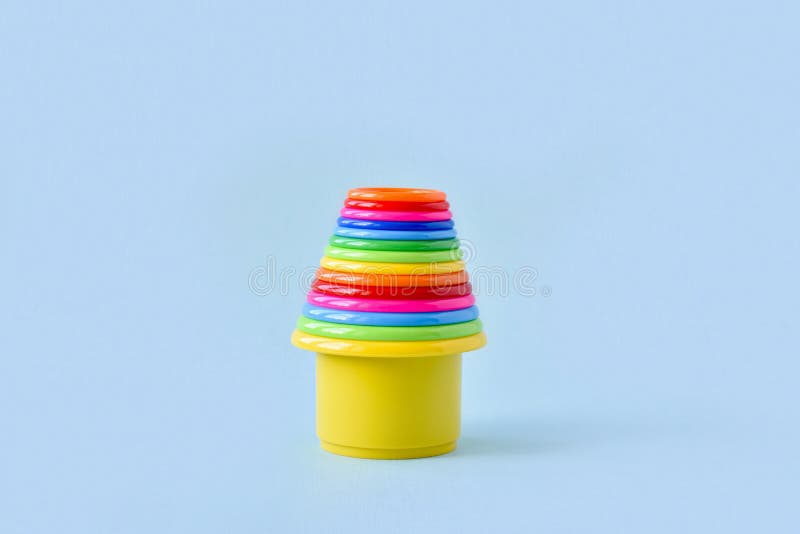 Multi-colored Pyramid Cups on a Blue Background Stock Photo - Image of ...
