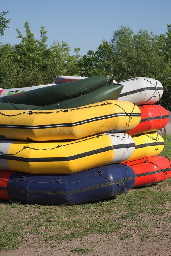 Multi-colored Rafting Boats Stacked on Top of Each Other Stock Photo ...