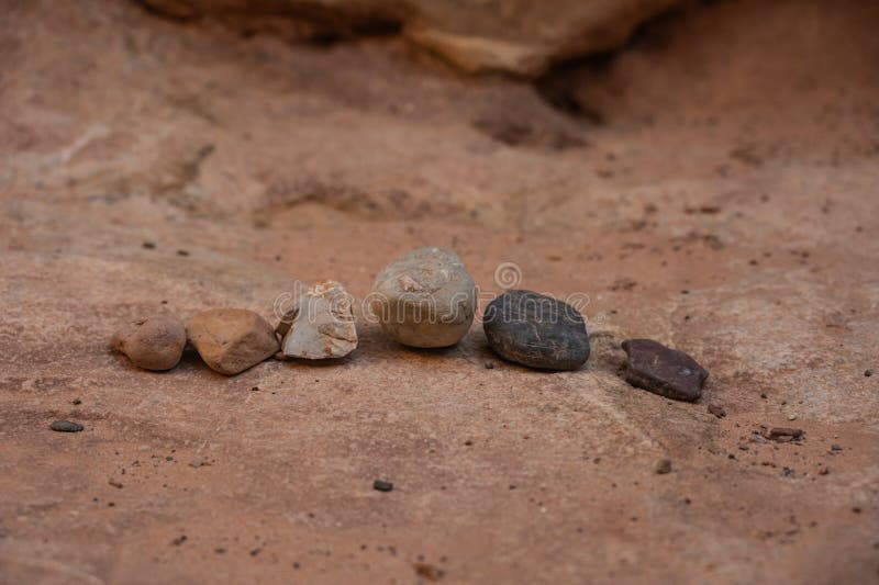 Multi Colored Rocks Lined Up on Rock Shelf Stock Photo - Image of ...
