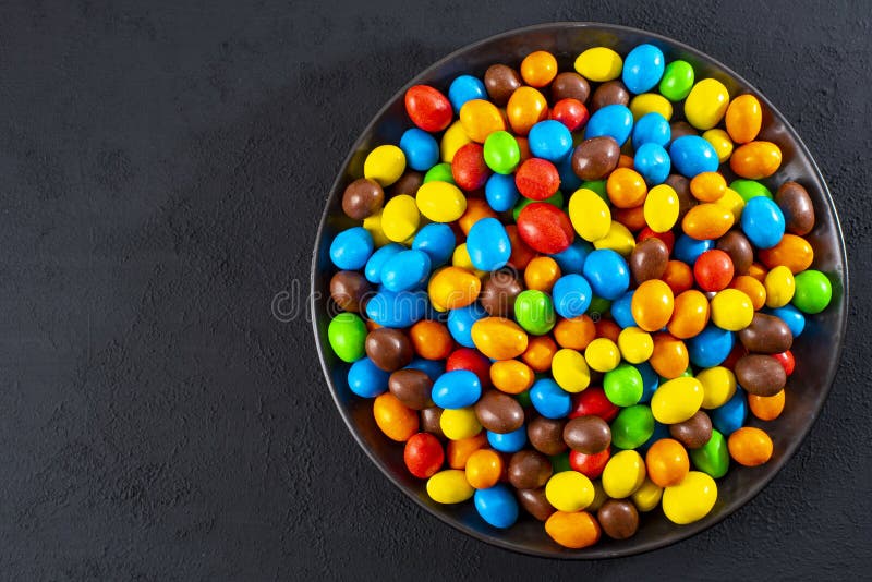 Multi-colored Round Candies in Colored Glaze in Large Quantities Stock ...