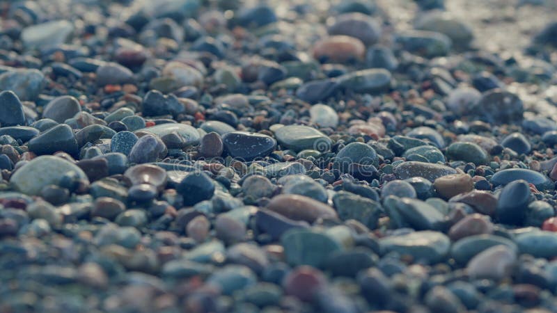 Multi-Colored Round Sea Pebble on Sea Coast. Wave Leaves White Marks ...