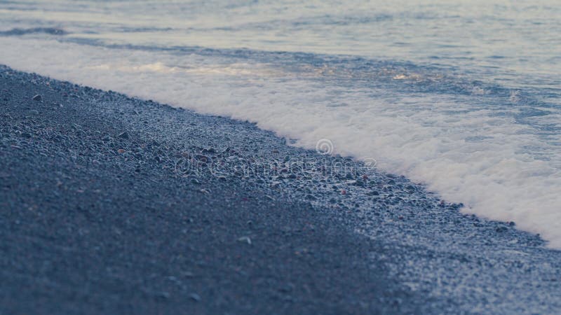 Multi-Colored Round Sea Pebble on Sea Coast. Wave Leaves White Marks ...