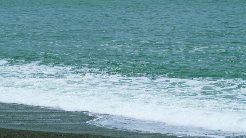 Multi-Colored Round Sea Pebble on Sea Coast. Wave Leaves White Marks ...