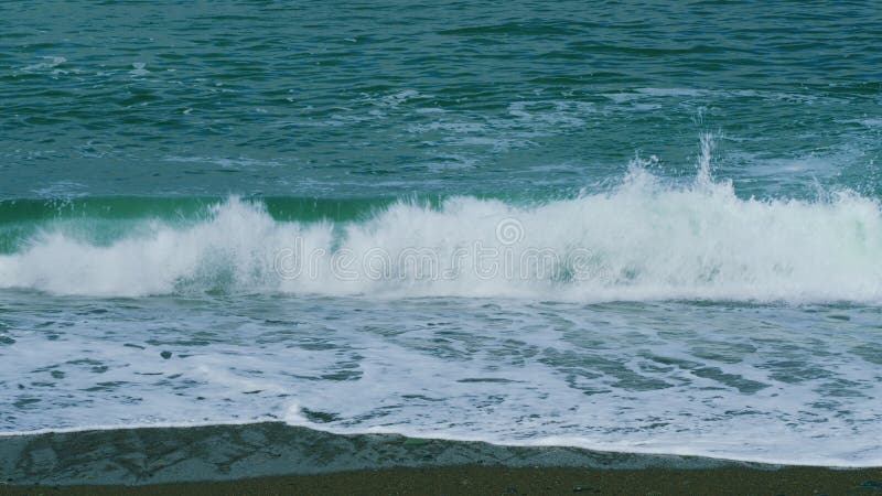 Multi-Colored Round Sea Pebble on Sea Coast. Wave Leaves White Marks ...