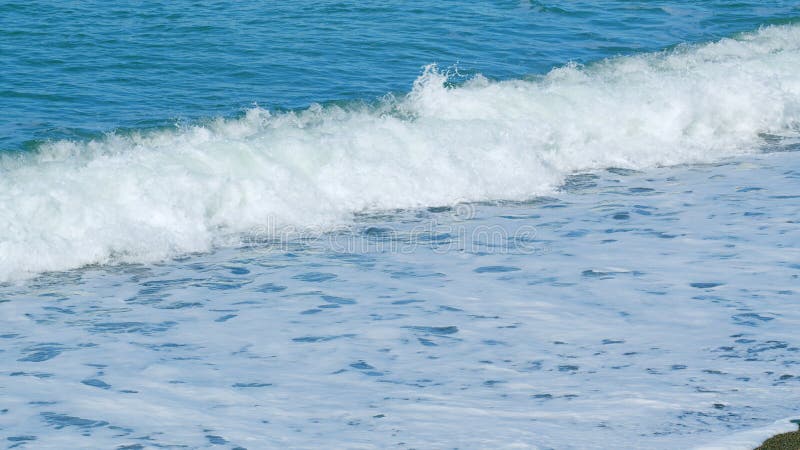 Multi-Colored Round Sea Sand on Sea Coast. Wave Leaves White Marks ...