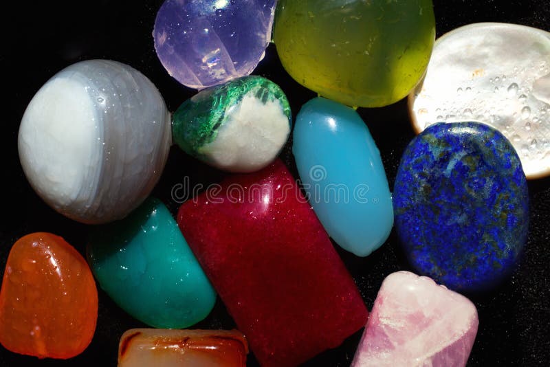 Multi-colored Semi-precious Stones on Black Close-up Stock Image ...