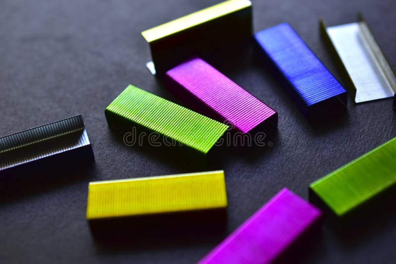 Multi-colored Stapler Staples on a Black Background Stock Photo - Image ...