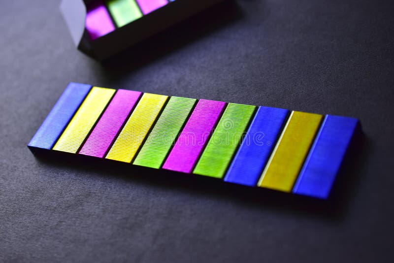Multi-colored Stapler Staples on a Black Background Stock Photo - Image ...