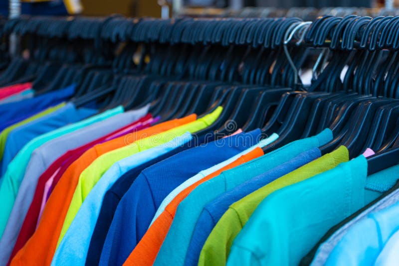 Multi-colored T-shirts on a Hanger. Clothing Store Stock Photo - Image ...