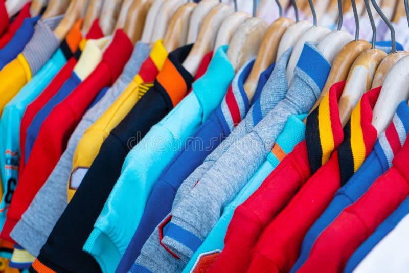 Multi-colored T-shirts on a Hanger. Clothing Store Stock Image - Image ...