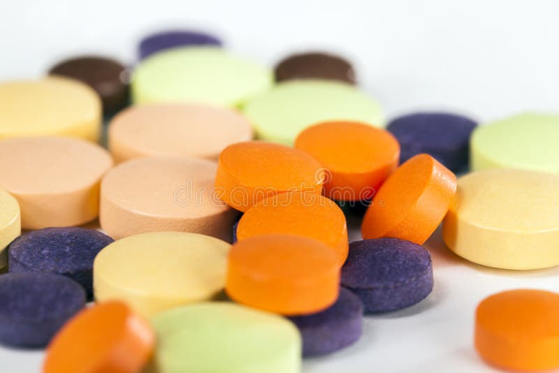 Multi-colored tablets stock photo. Image of medication - 223354138