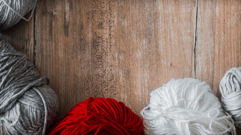 Multi-colored Thread for Knitting. Yarn for Knitting on a Wooden ...