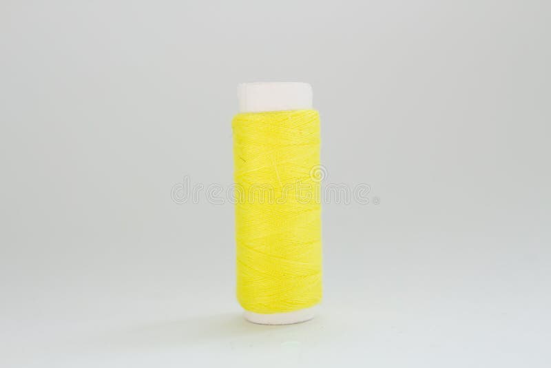 Yellow Threads for Sewing on a White Background Stock Photo - Image of ...