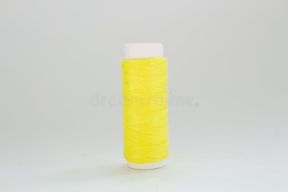 Yellow Threads for Sewing on a White Background Stock Photo - Image of ...