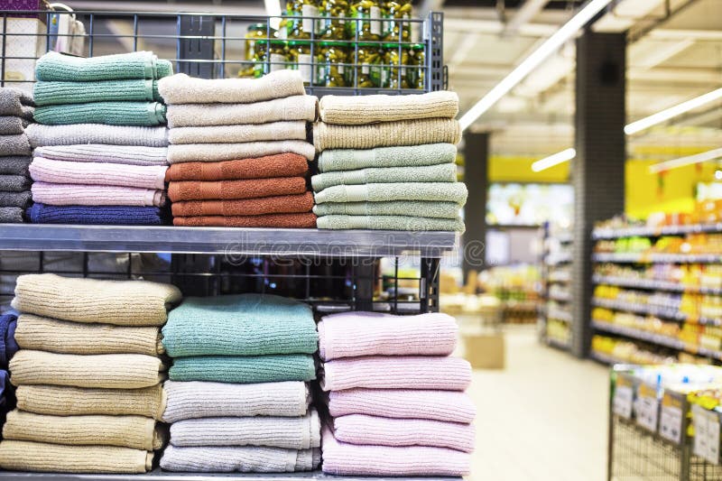 Multi-colored Towels in a Stack on the Shelves in the Supermarket ...