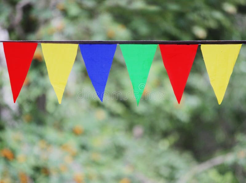 Multi Colored Triangular Flags Hanging in the Sky at an Outdoor Against ...