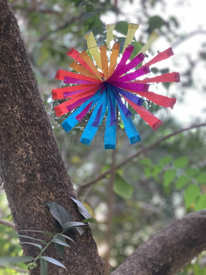 A Multi Colored Wind Mill in Tree Stock Image - Image of nature, blue ...