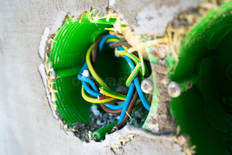 Multi-colored Wires in a Green Socket Under the Socket on the Facade of ...