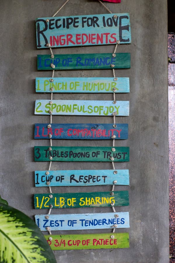 Multi-colored Wooden Sign on a Gray Wall Stock Image - Image of ...