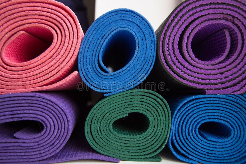 Multi-colored Yoga Mats in the Gym Stock Photo - Image of table, mats ...