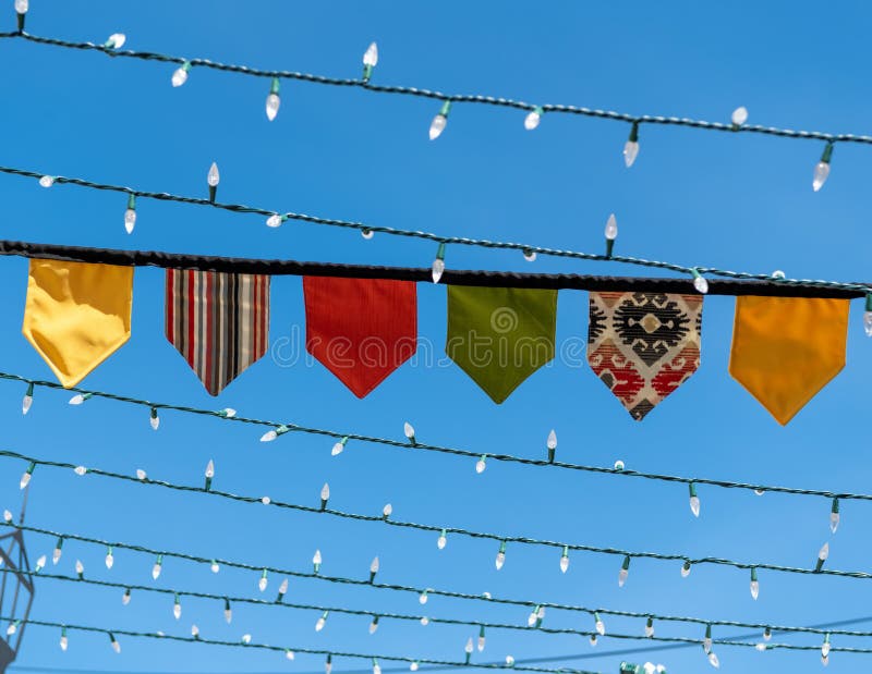 Multi Colour Cloth Flags on a Wire with Lights Stock Photo - Image of ...