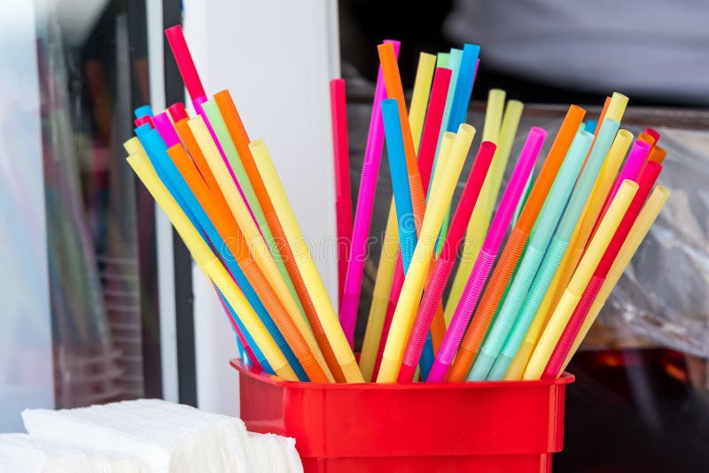 Multi Coloured Plastic Straws for Hot or Cold Drinks in Display at a ...