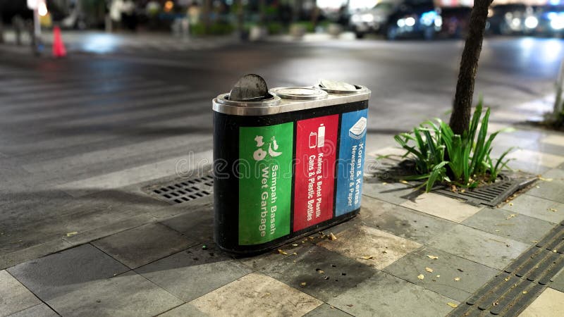 Multi-compartment Stainless Steel Trash Can for Waste Segregation on a ...