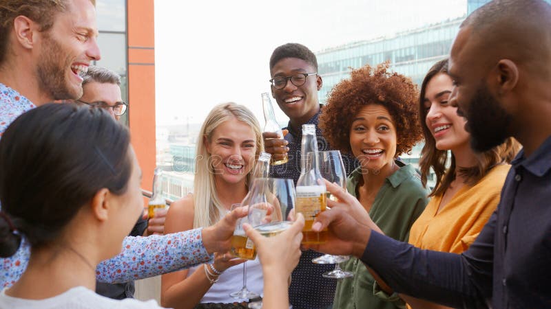 Multi-Cultural Business Team Celebrating Outdoors for after Work Drinks ...