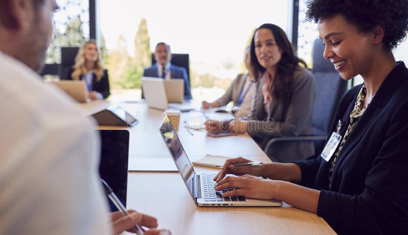 Multi-Cultural Business Team Meeting and Collaborating Around Table in ...