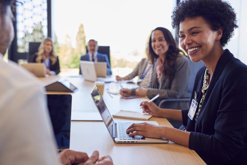 Multi-Cultural Business Team Meeting and Collaborating Around Table in ...