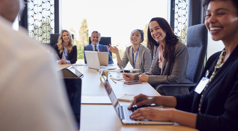 Multi-Cultural Business Team Meeting and Collaborating Around Table in ...