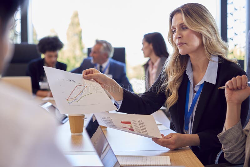 Multi-Cultural Business Team Meeting and Collaborating Around Table in ...