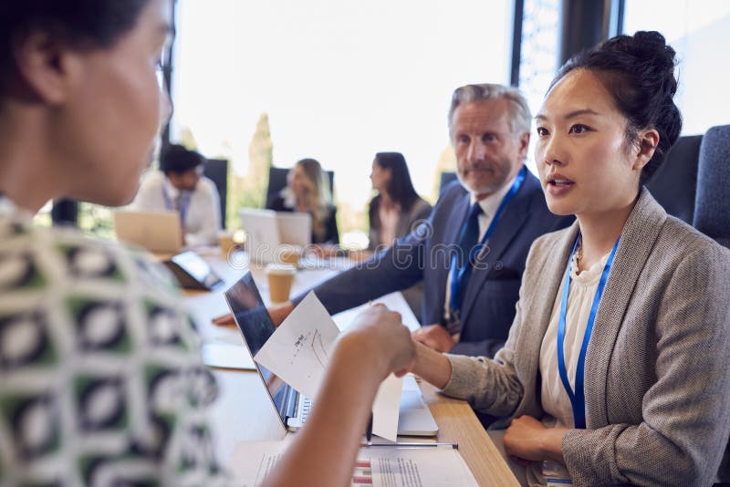 Multi-Cultural Business Team Meeting and Collaborating Around Table in ...