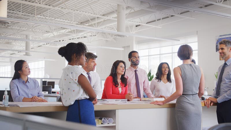 Multi-Cultural Business Team Meeting in Modern Open Plan Architects ...