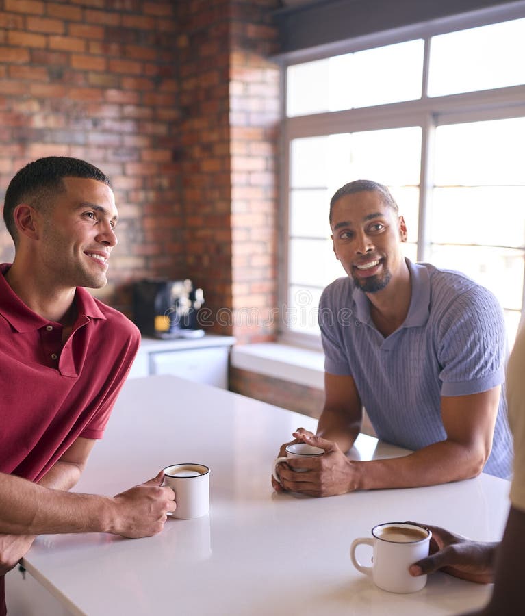 Multi-Cultural Businessmen Taking Coffee Break in Kitchen Area of ...