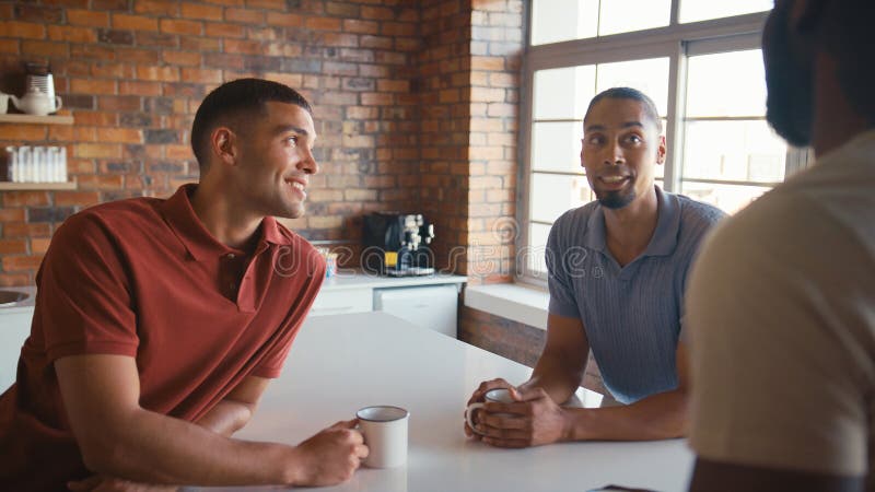 Multi-Cultural Businessmen Taking Coffee Break in Kitchen Area of ...