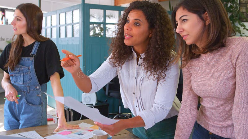 Multi-Cultural Female Business Team Meeting in Office Discussing ...
