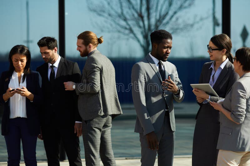 Business Group Discussing Results of Research Outdoors Stock Photo ...