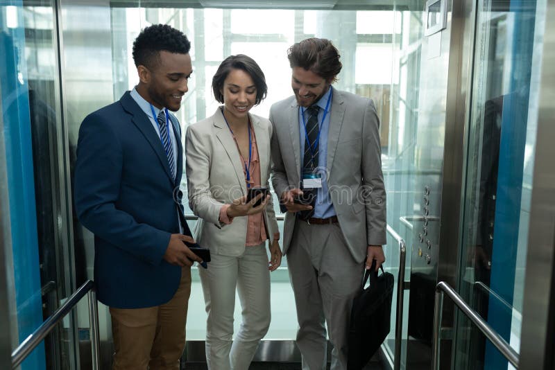 Multi-ethnic Business People Discussing Over Mobile Phone in the ...