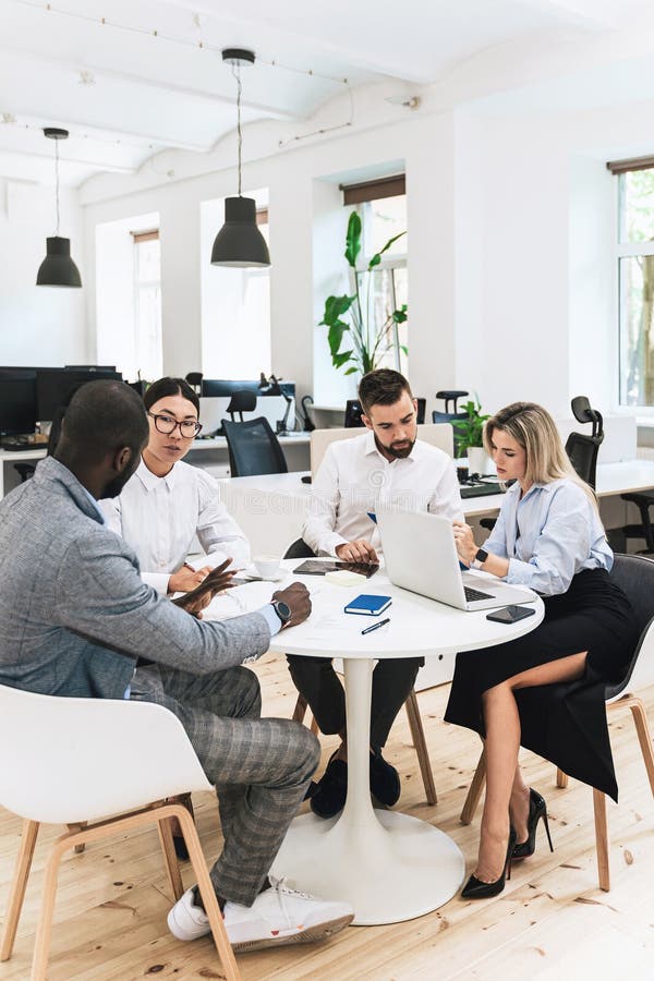 Multi-ethnic Business People during Meeting in Modern Office Stock ...