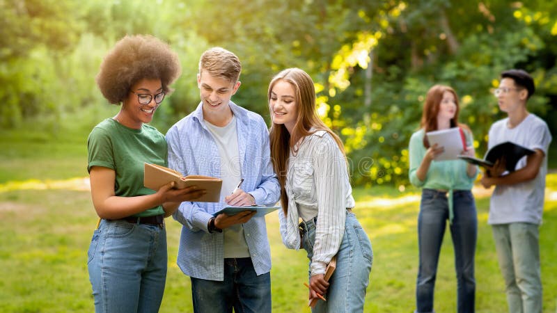 Multi-ethnic College Students Resting Outdoors after Classes, Chatting ...