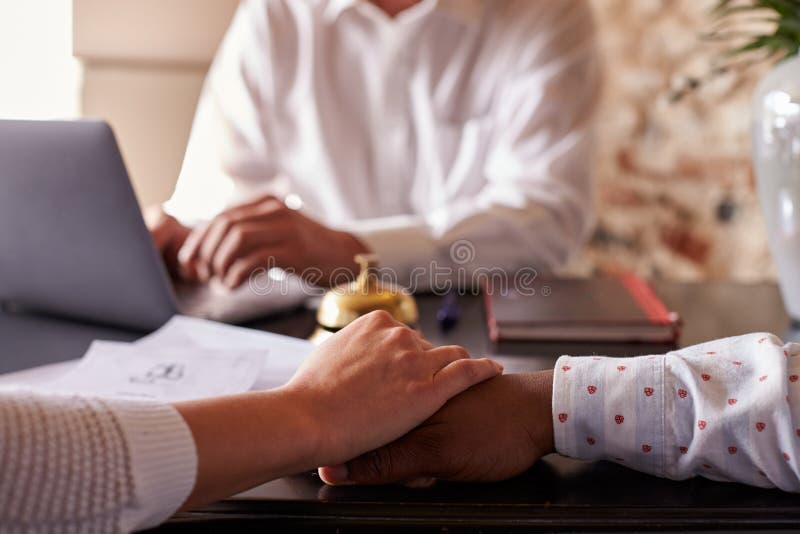Multi Ethnic Couple Hold Hands at Hotel Check in Desk, Detail Stock ...