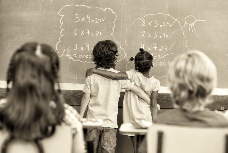 Multi Ethnic Elementary Students Embraced Learning Math at Chalk Stock ...